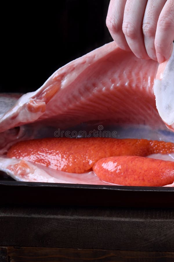 Red Caviar in the Egg Sack Inside Trout Stock Photo - Image of ...