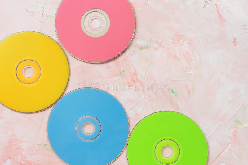 CD or DVD Discs on Pink Background Stock Image - Image of green ...