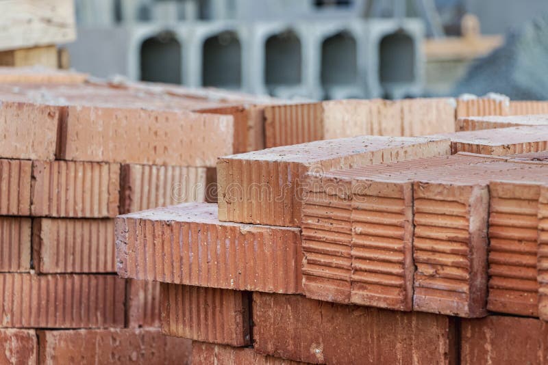 Red Ceramic Bricks Stacked on a Construction Site. Construction ...