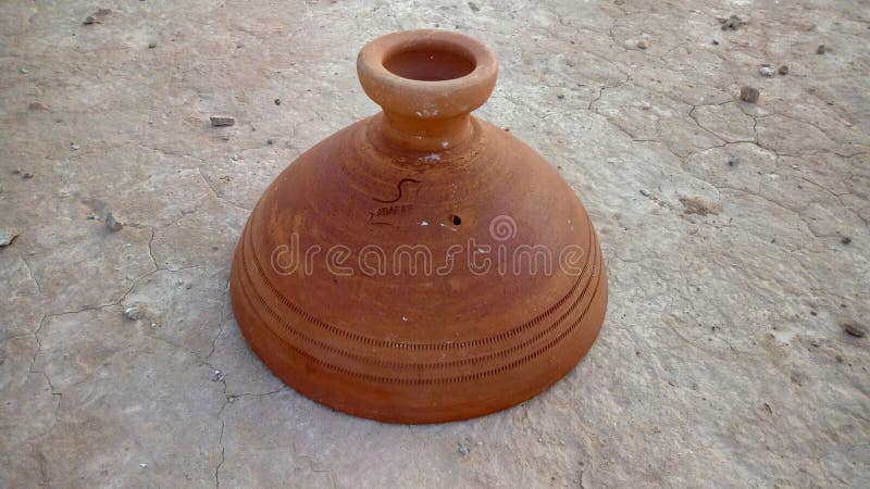 A Red Ceramic Cover Used To Cover Clay Cooking Pots Stock Photo - Image ...
