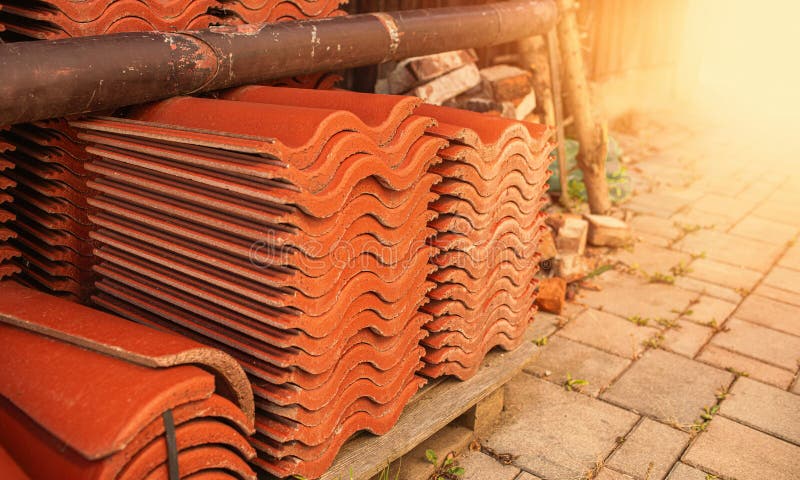 Red Ceramic Roof Tiles Stack in Backyard.High Quality Photo Stock Image ...