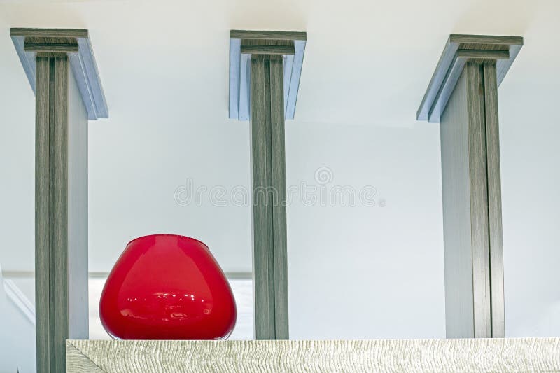 Red Ceramic Vase on a Stylish Modern Rack Stock Photo - Image of ...