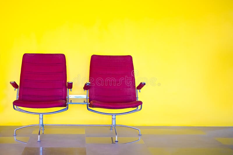 Red Chairs Against Yellow Wall. Stock Image - Image of design, form ...