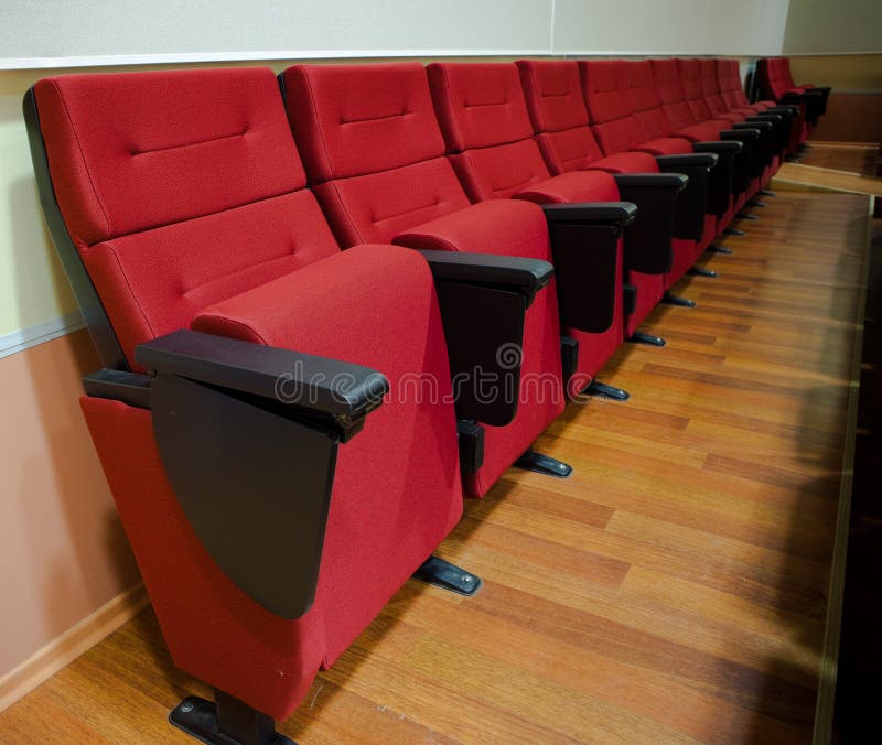Red chairs in the hall stock photo. Image of professional - 11112662