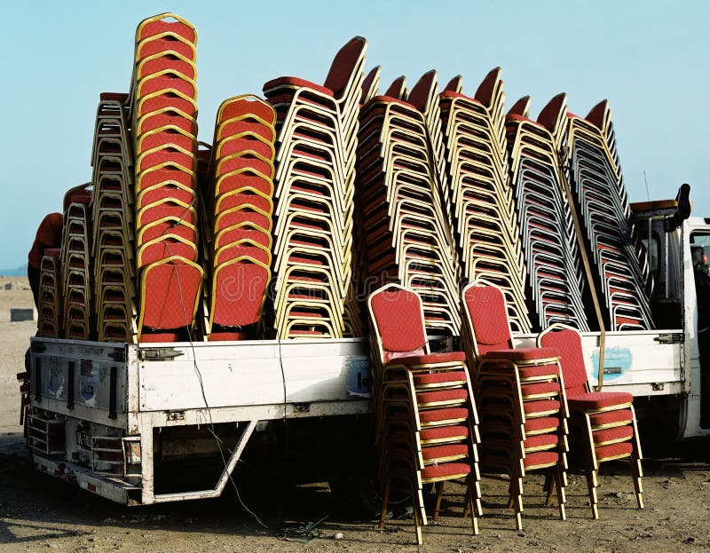 Chairs Stacked on the Back of a Truck Outdoors Stock Image - Image of ...