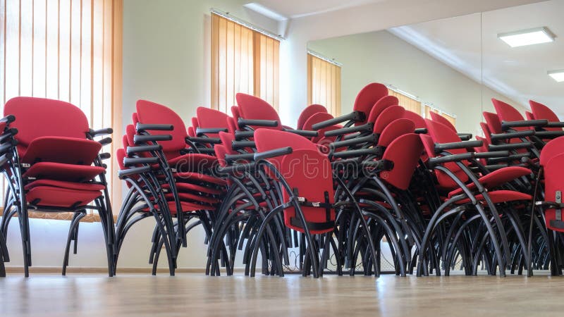 Red chairs stacked stock image. Image of mess, floor - 218224237