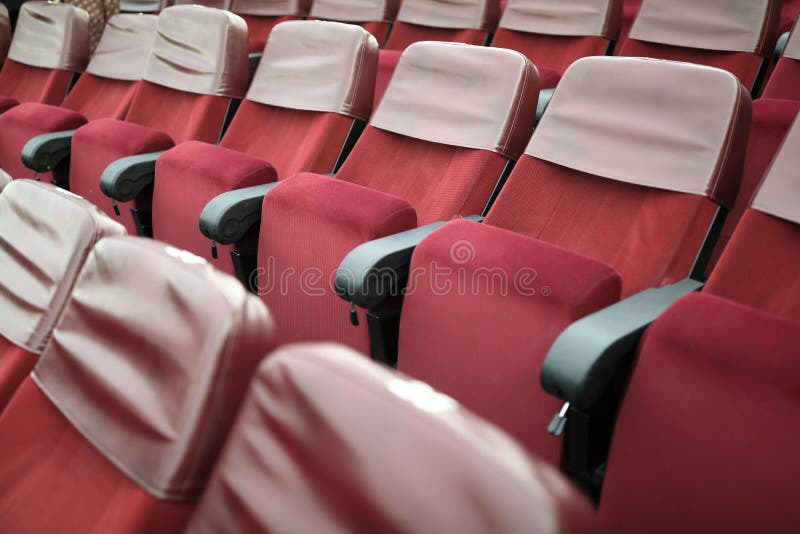 Red chairs in theater stock image. Image of meeting - 113489749