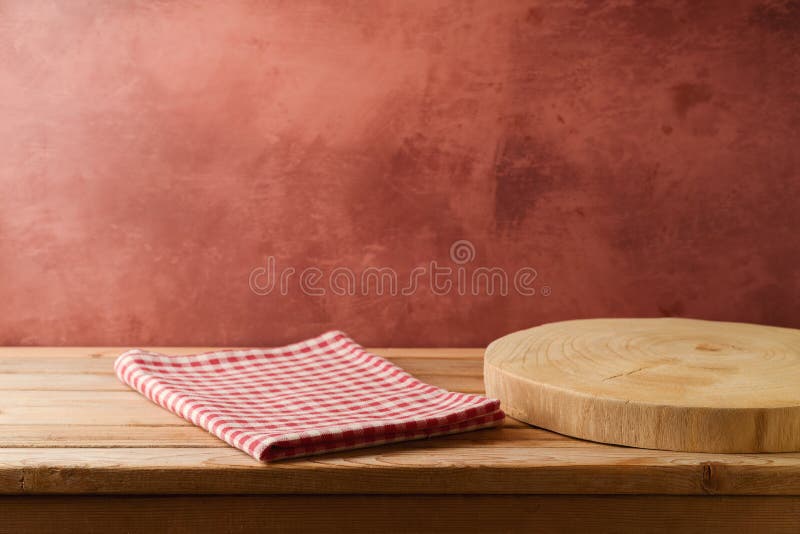 Red Checked Tablecloth and Wooden Log on Table Over Rustic Wall ...