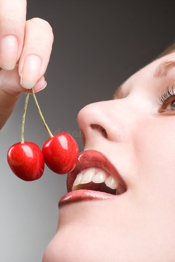 Woman Eating Cherry stock image. Image of girl, face - 31454021