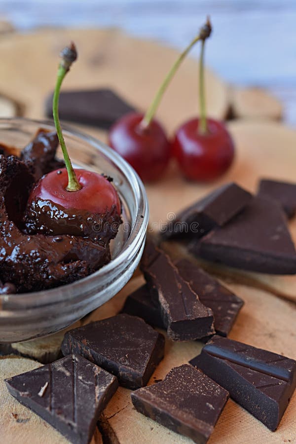 Red Cherry in Chocolate Chips and Dark Chocolate Pieces. Dessert Stock ...