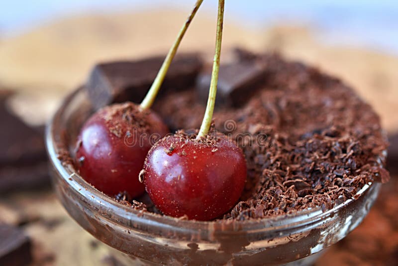 Red Cherry in Chocolate Chips and Dark Chocolate Pieces. Dessert Stock ...