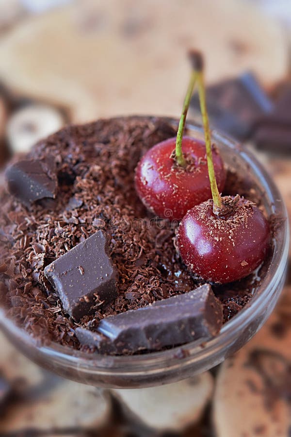 Red Cherry in Chocolate Chips and Dark Chocolate Pieces. Dessert Stock ...
