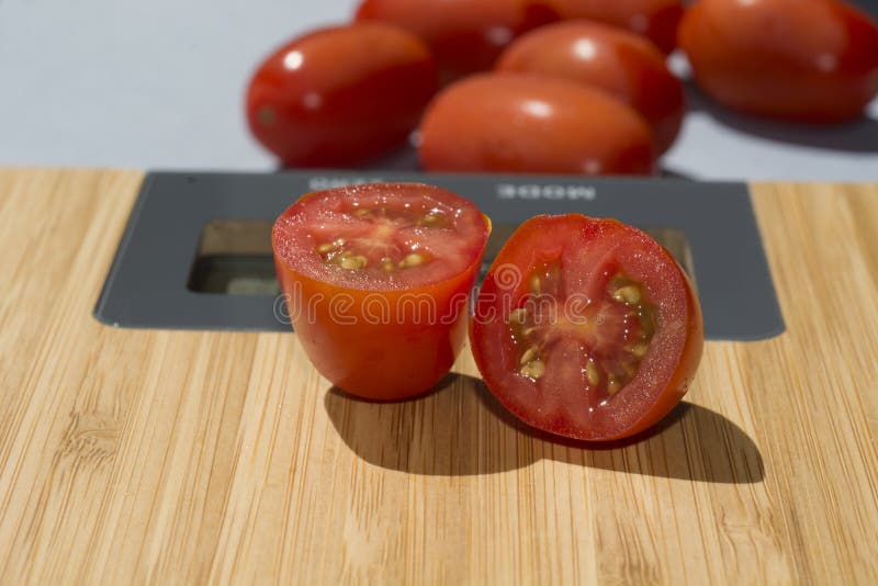 Red Cherry Pear Tomato on Kitchen Scale Stock Image - Image of ...