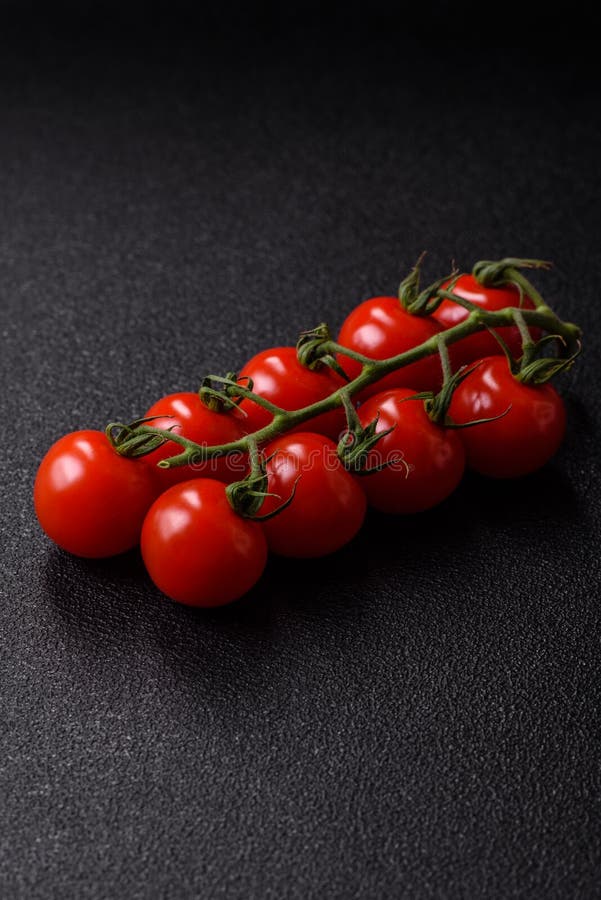 Red Cherry Tomatoes on a Branch, a Vegetable As an Ingredient for ...