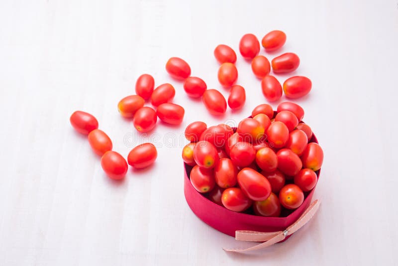 Red Cherry Tomatoes in Gift Box on White Table Background Stock Image ...