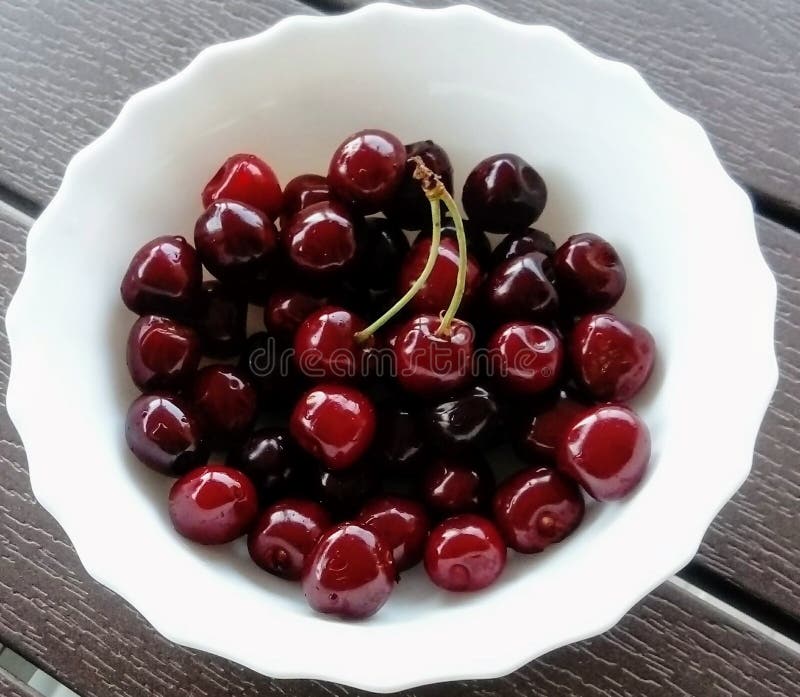 Red cherry in a white bowl stock photo. Image of beautiful - 116836740