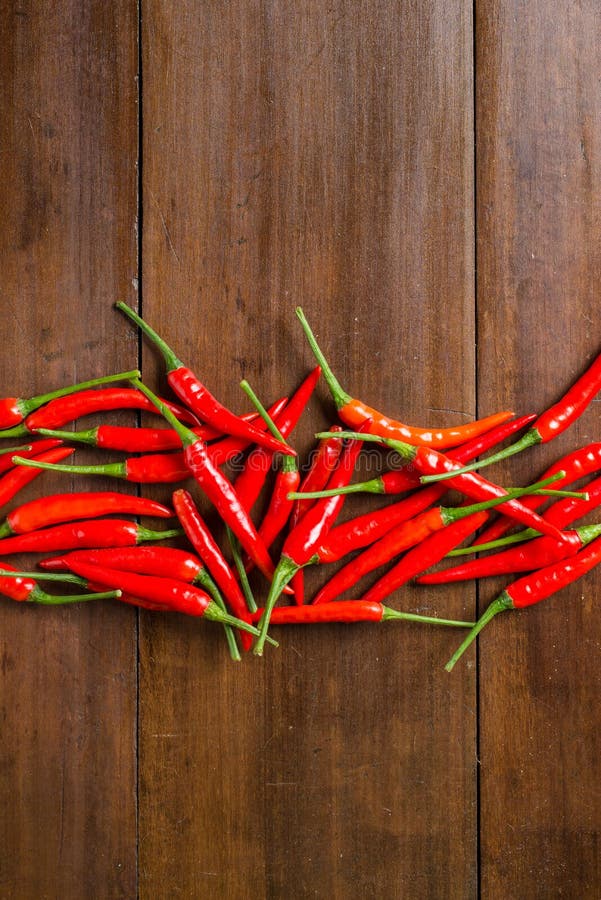 Red Chili Peppers on Wooden Background Stock Photo - Image of rope ...