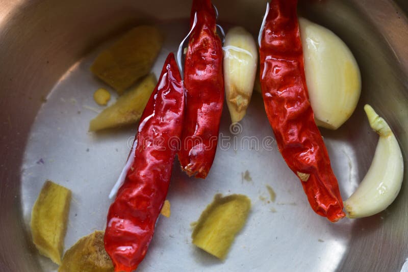 Red Chilli or Red Mirchi , Garlic and Ginger Pisces on Water Stock ...