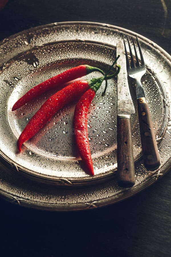 Chili Peppers on a plate stock image. Image of plate - 103928049