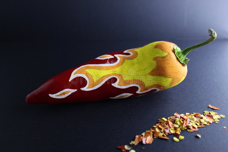 Red Chilli Pepper with Painted Fire on Black Craft Paper Background ...