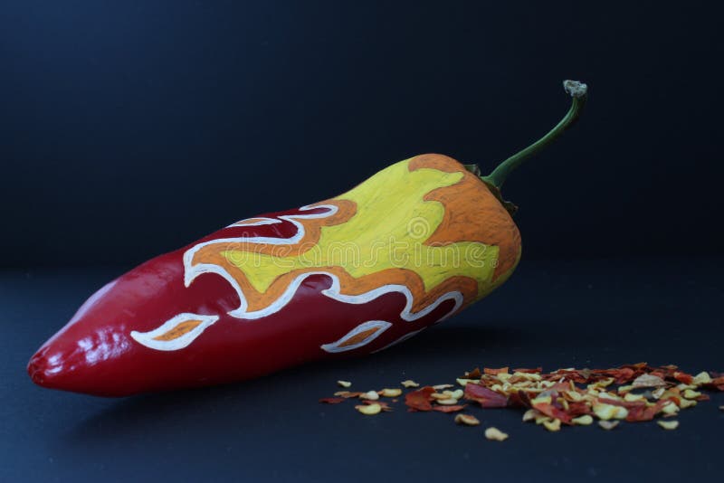 Red Chilli Pepper with Painted Fire on Black Craft Paper Background ...