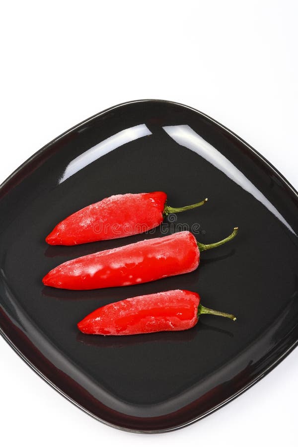 Red Chilli Peppers Isolated on a Plate Stock Photo - Image of pepper ...