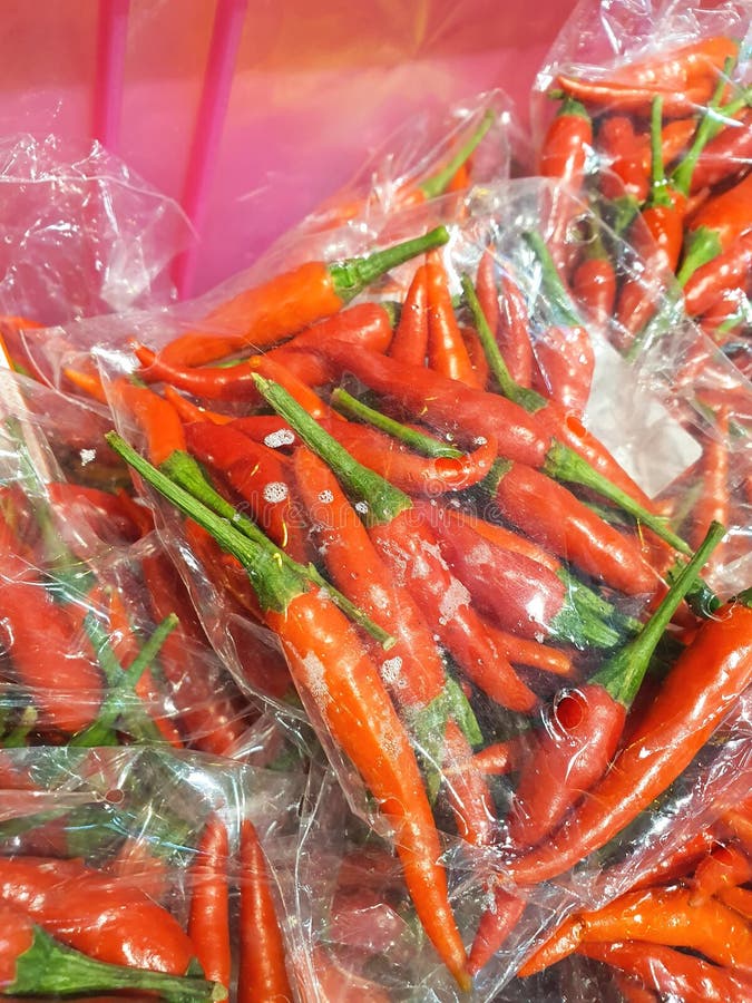 Red chilli sold in Market stock image. Image of long - 168943231