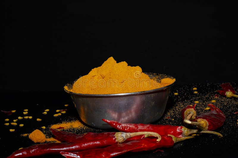 Red Chilly or Mirchi with Powder in a Bowl Over Black Background ...