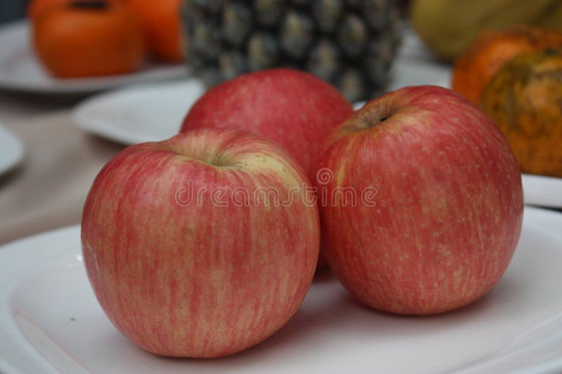 Red Chinese Apples on the White Ceramic Plate in Close-up Shot. Stock ...