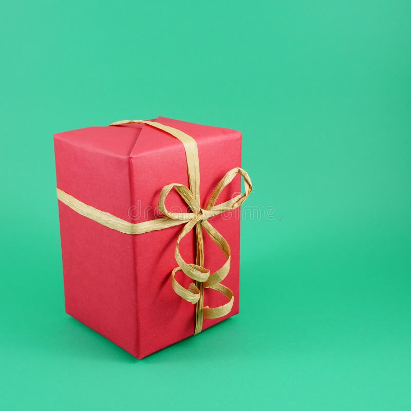 Red Christmas Gift Box with Brown Paper Ribbon Bow Stock Photo - Image ...