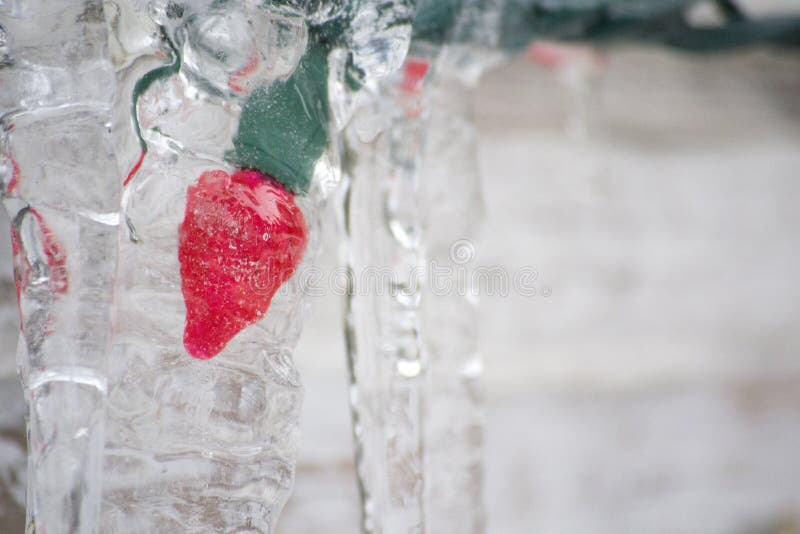 Red Christmas Light in Ice stock photo. Image of creative - 32324894