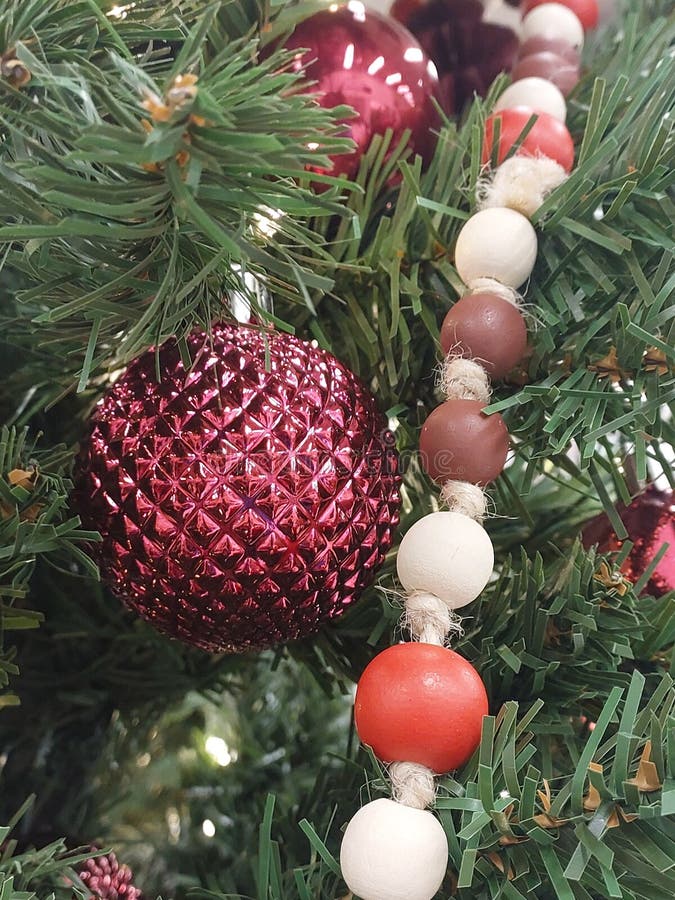Red Christmas Ornament and Beads Hanging on a Christmas Tree Stock ...