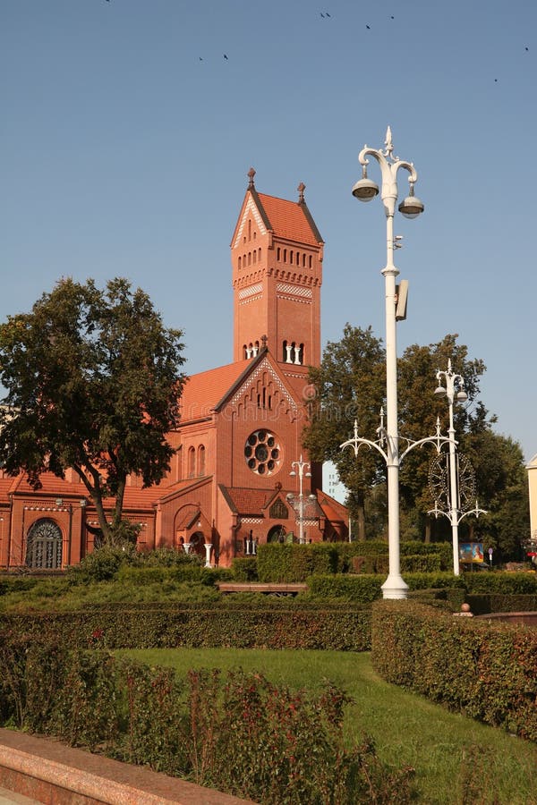 Red church stock image. Image of huddled, greenery, houses - 216166063