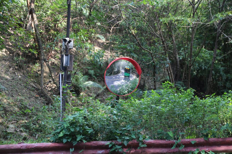 A Red Circle is Reflected in a Mirror on a Road Stock Image - Image of ...