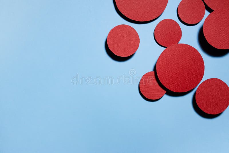 Red Circles Soar on Blue Background in Hard Light with Shadows As ...