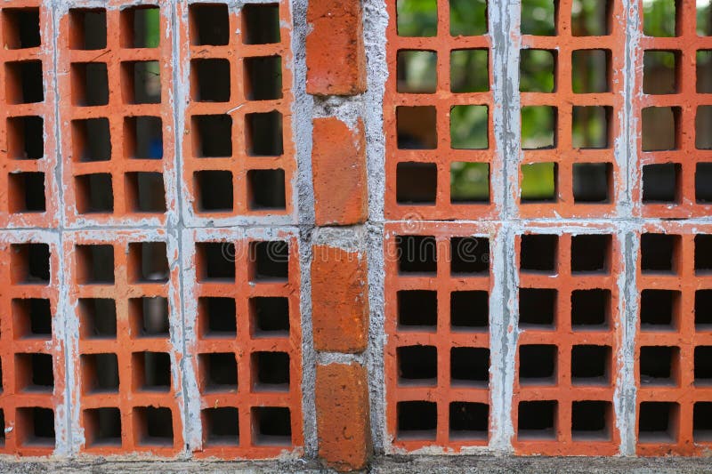 Red Clay Bricks Form a Structured Wall with Small Square Openings Stock ...