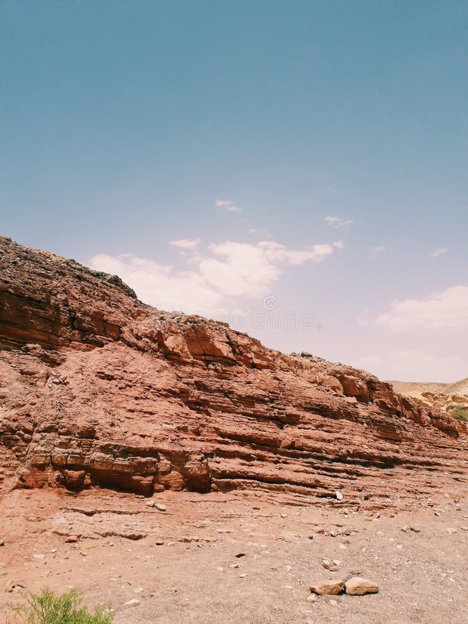 The Red Cliff of the Red Desert Stock Image - Image of clouds, cliff ...