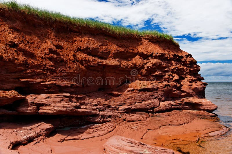 Red Sand Shores of Prince Edward Island Stock Photo - Image of house ...