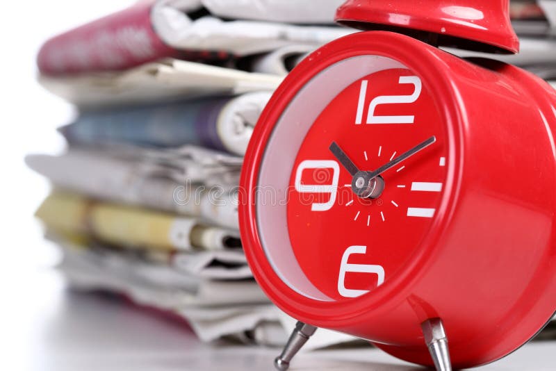 Clock and pen on newspaper stock image. Image of finance - 7597367