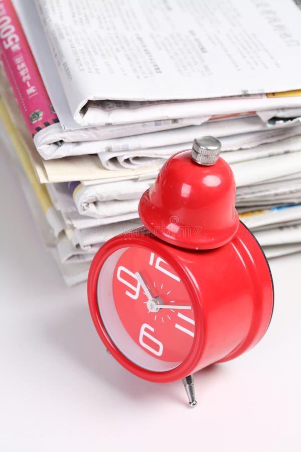 Clock and pen on newspaper stock image. Image of finance - 7597367
