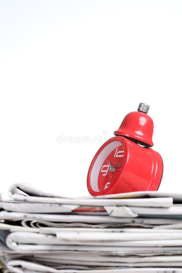 Red clock and newspaper stock photo. Image of journal - 12321626