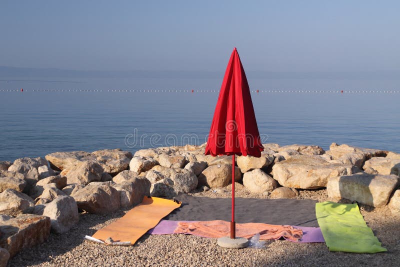 Red Closed Parasol on the Beach Stock Image - Image of evening, parasol ...