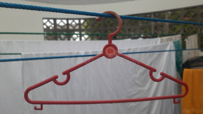 Red Clothes Hanger for Drying Stock Photo - Image of hanger, clothes ...