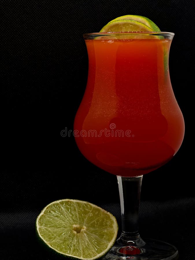 Red Cocktail Decorated with Lime on a Black Background Stock Image ...