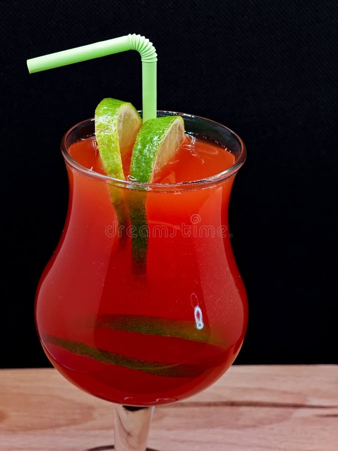 Red Cocktail Decorated with Lime on a Black Background Stock Photo ...