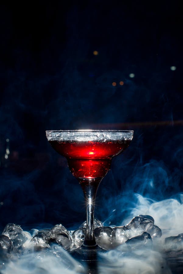 Red Cocktail with Ice Vapor, Blue Background Stock Image - Image of ...