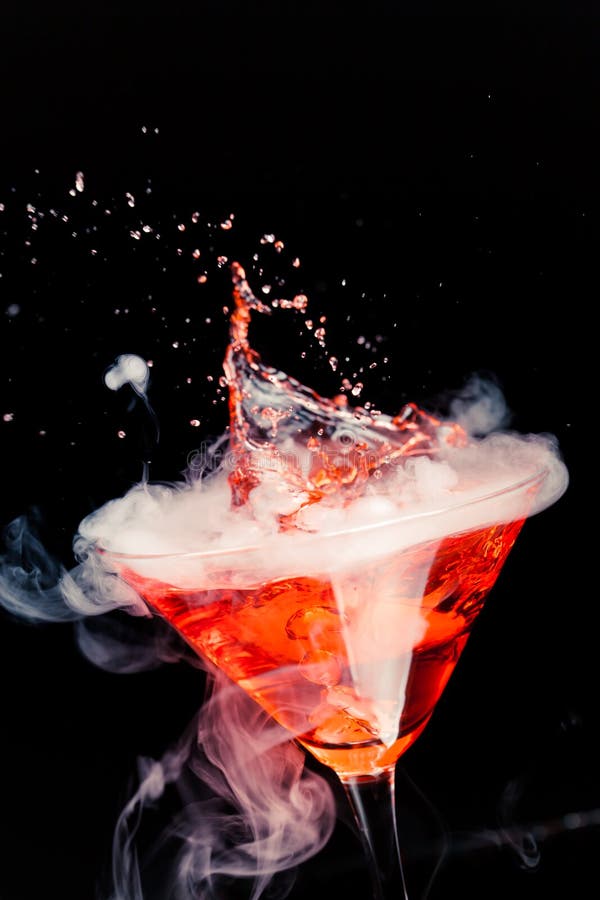 Red cocktail with splash stock image. Image of black - 34511403