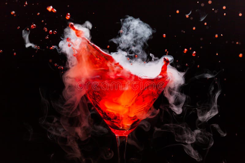 Red cocktail with splash stock image. Image of glass - 34689339