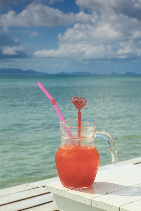 Red Cocktail on White Table Set Over Ocean Stock Photo - Image of ...