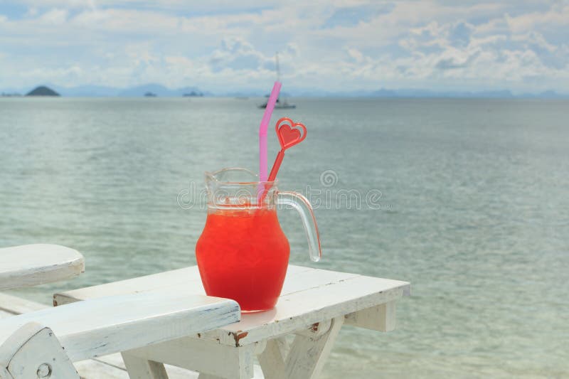 Red Cocktail on White Table Set Over Ocean Stock Photo - Image of drink ...